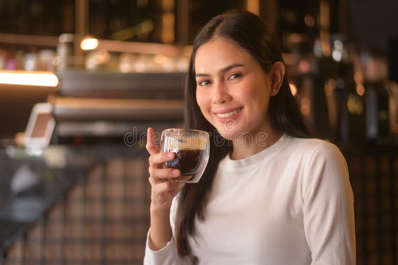 Young Woman Drinking Coffee in Modern Coffee Shop Stock Photo - Image ...