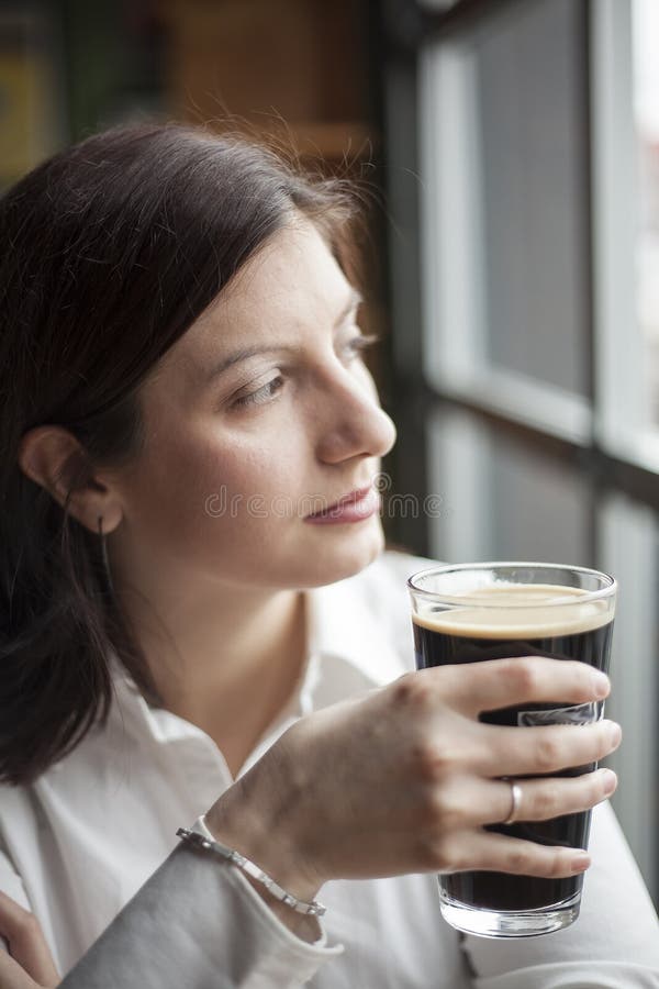 Young Woman Drinking a Pint of Stout Stock Image - Image of alcohol ...