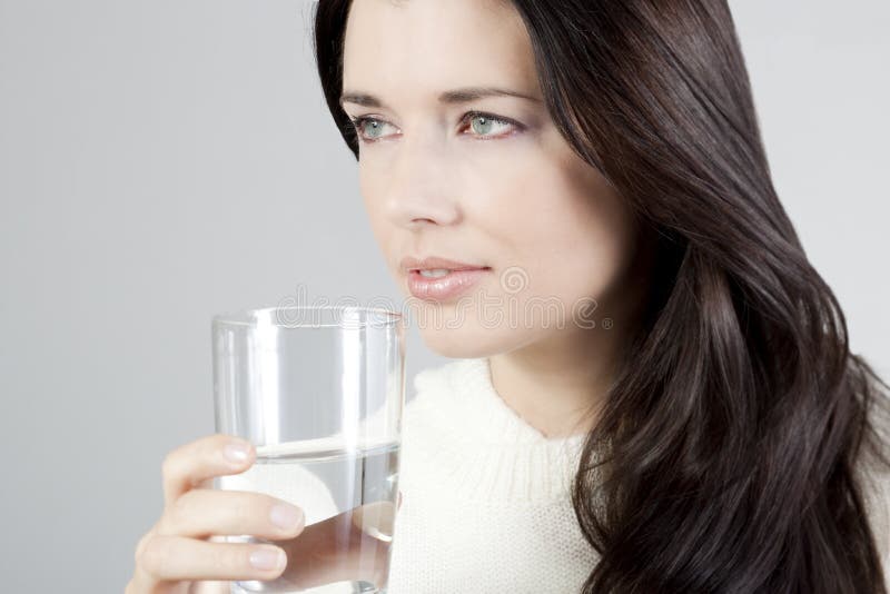 Young woman drinking water stock image. Image of copy - 15887959
