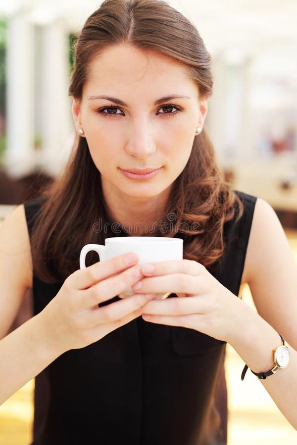 Young Beautiful Woman Drinks Coffee in Cafe Stock Image - Image of ...