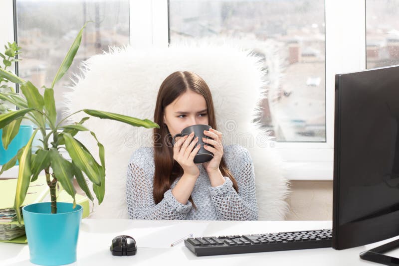Young Woman Drinks Coffee in Front of a Computer at Home Stock Photo ...