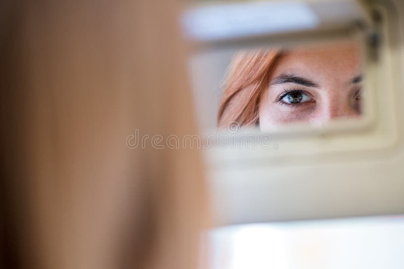 Young Woman Driver Checking Rear View Mirror Looking Backwards while ...