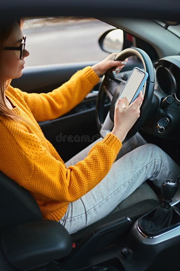 Young Woman Driver Using Mobile Phone while Driving Car, Unsafe Driving ...