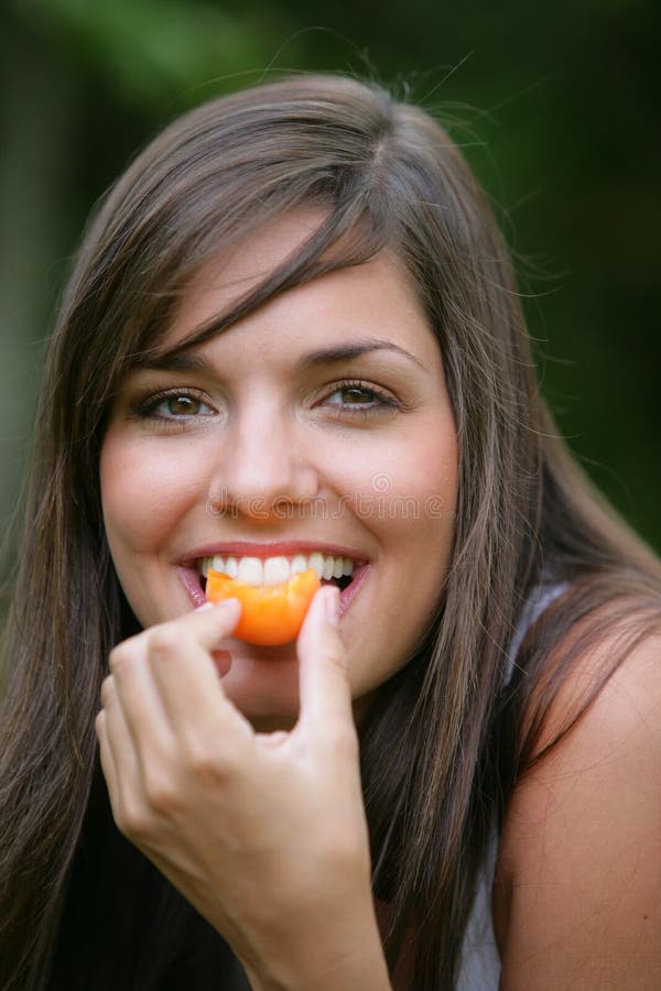 Young Woman Eating Apricots Stock Photo - Image of beauty, health: 10345996