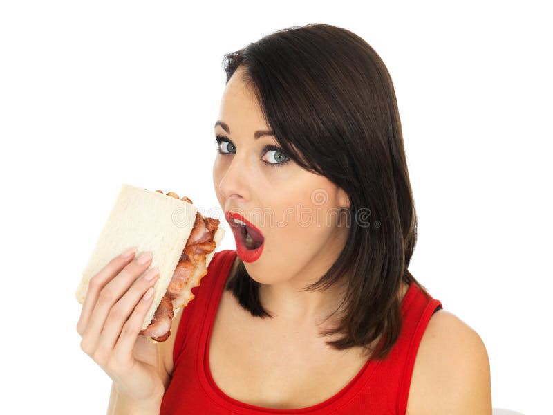 Young Woman Eating a Bacon Sandwich Stock Photo - Image of isolated ...