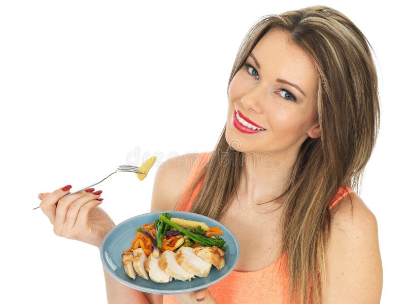 Young Woman Eating Chicken with Mixed Vegetables Stock Image - Image of ...