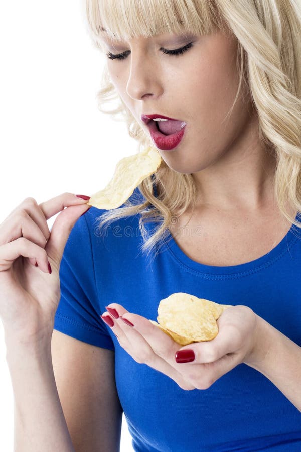 Young Woman Eating Crisps stock image. Image of crisps - 51127025
