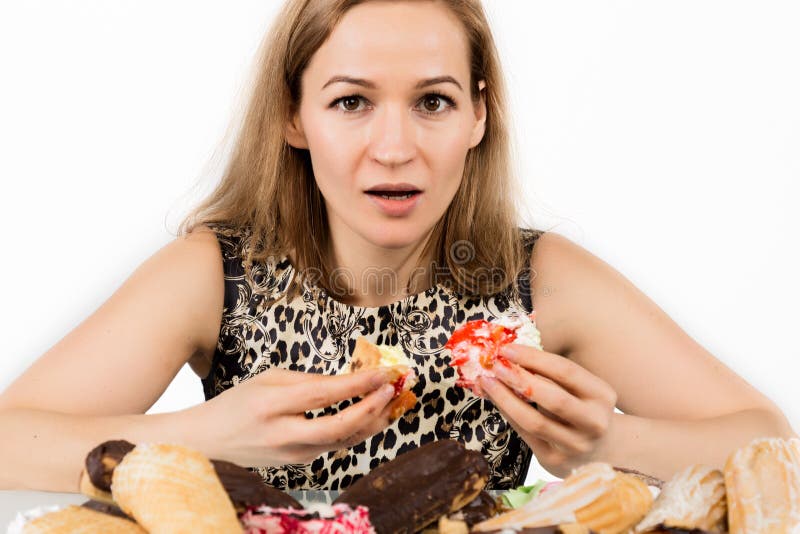 Young Woman Eating Cupcakes with Pleasure after a Diet Stock Photo ...
