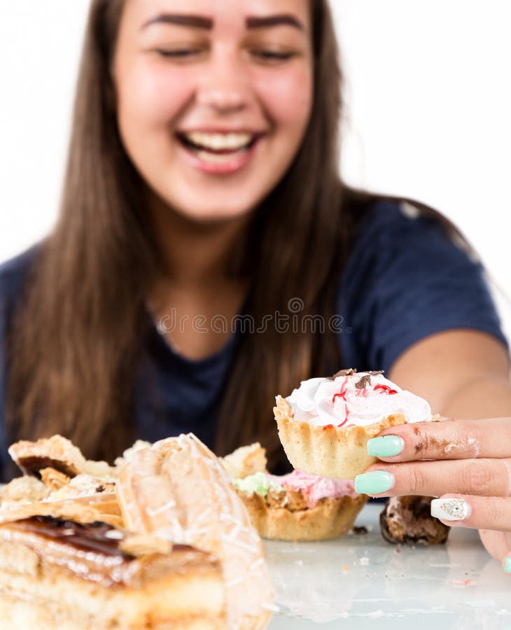 Glutton Woman Eating Cupcakes with Frenzy after Long Diet Stock Photo ...