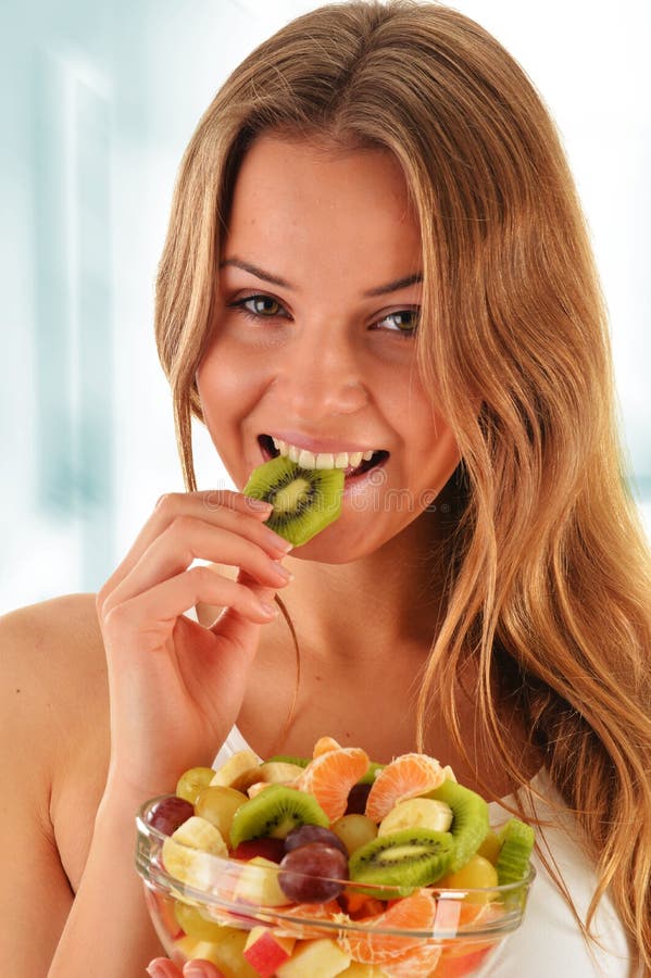 Young Woman Eating Fruit Salad Stock Image - Image of balanced, food ...