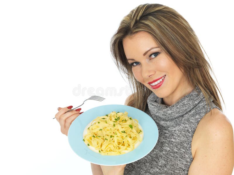 Young Woman Eating Pasta stock photo. Image of young - 52046276