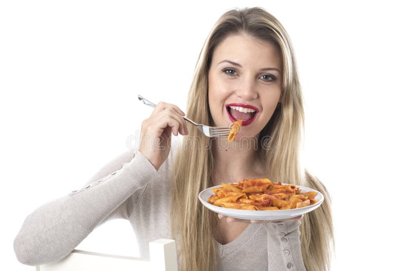 Young Woman Eating Penne Pasta Stock Photo - Image of posing, isolated ...