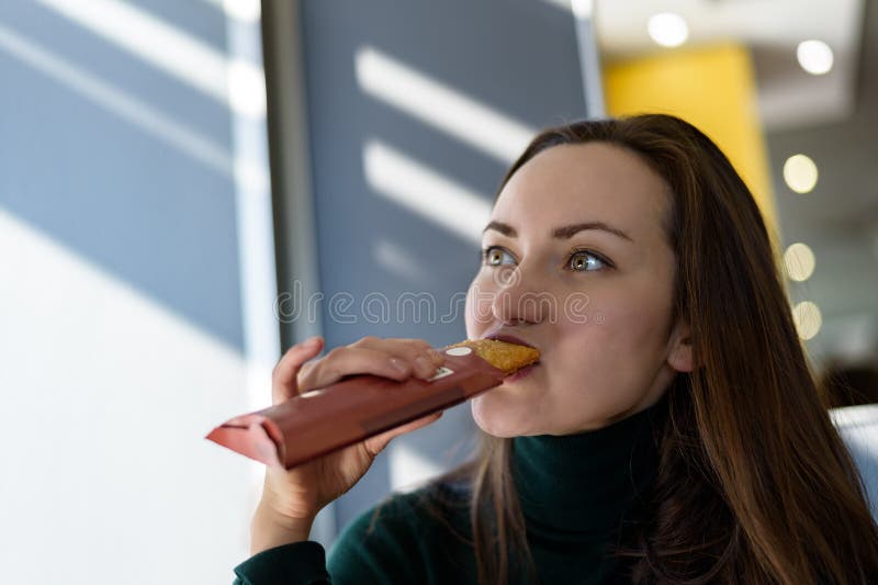 Young Woman Eating Pie at the Bistro at Lunchtime Stock Photo - Image ...