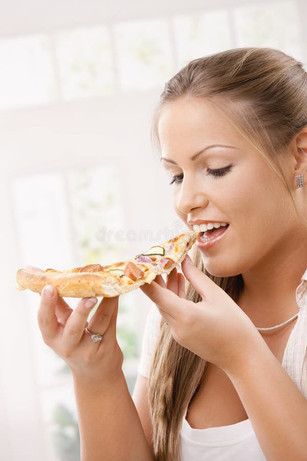 Young woman eating pizza stock image. Image of food, cheese - 10087951