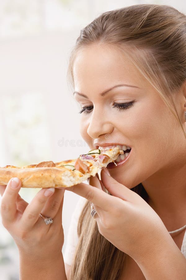 Young Woman Eating Pizza Slice Stock Image - Image of alone, cheese ...