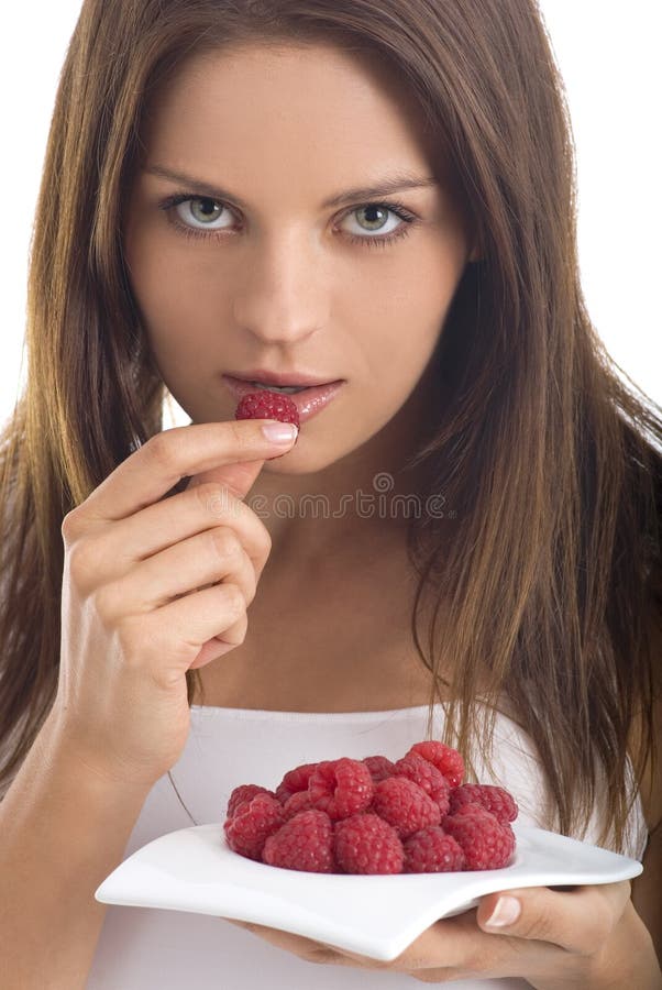 Young Woman Eating Raspberry Stock Photo - Image of girl, juicy: 5834838