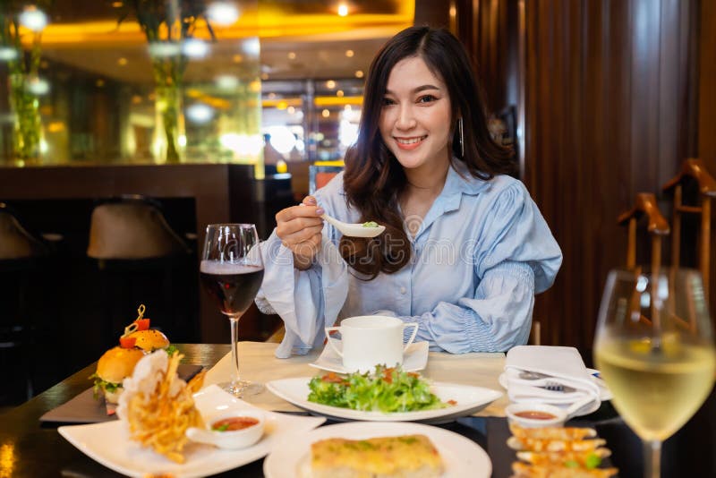 Young Woman Eating in the Restaurant Stock Photo - Image of dinner ...