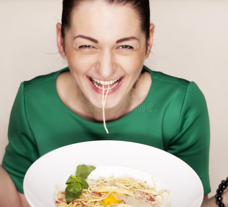 Young Woman Eating Spaghetti Stock Image - Image of long, eating: 48577109