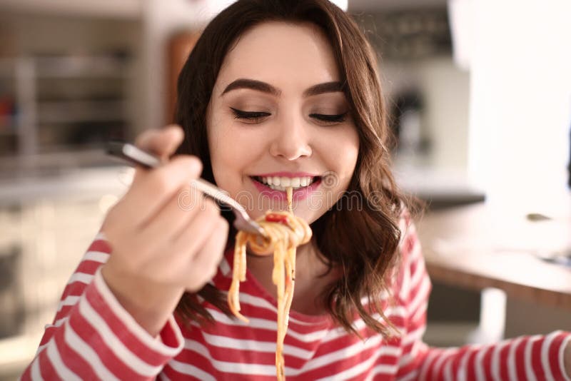 Young Woman Eating Tasty Pasta At Home Stock Image Image Of Healthy