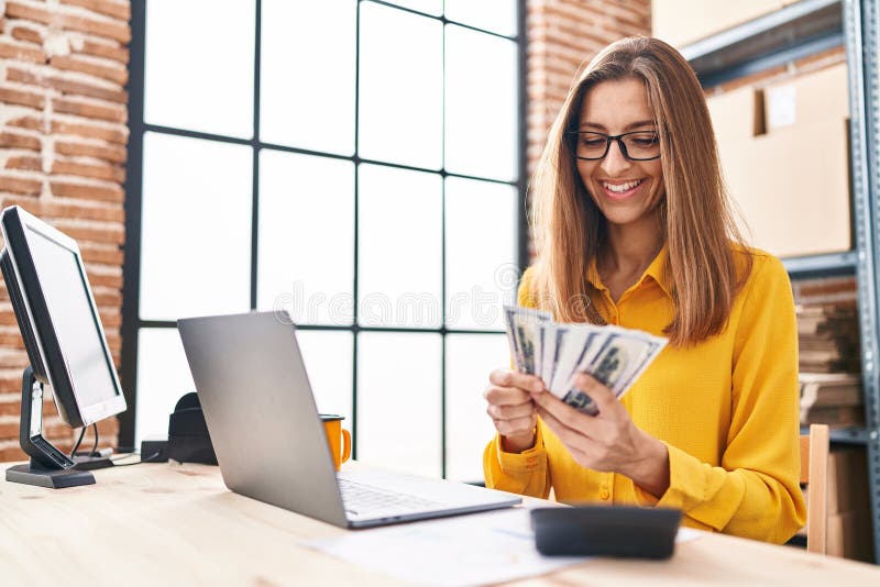 Young Woman Ecommerce Business Worker Counting Dollars at Office Stock ...