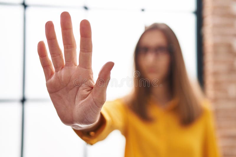 Young Woman Ecommerce Business Worker Doing Stop Gesture with Hand at ...