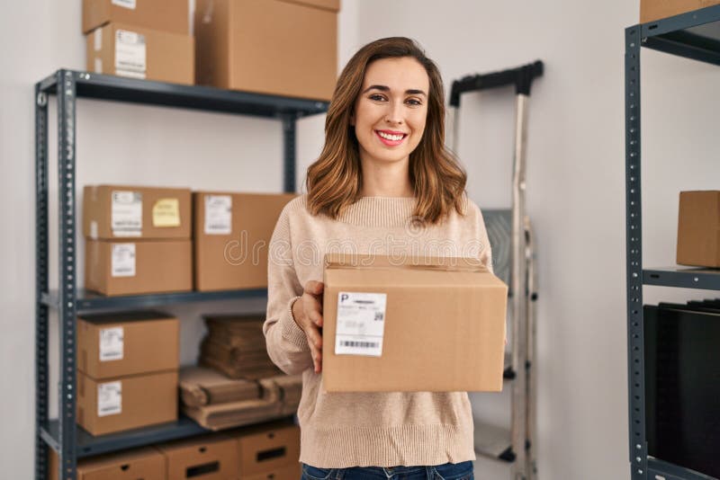 Young Woman Ecommerce Business Worker Holding Package at Office Stock ...