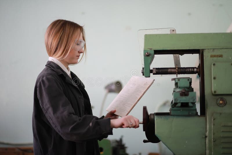 Young Woman Engineer Working at Machine Tool Stock Photo - Image of ...