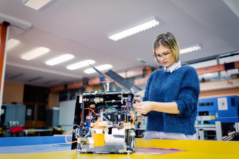 Young Woman Engineer Working on Robotics Project Stock Photo - Image of ...
