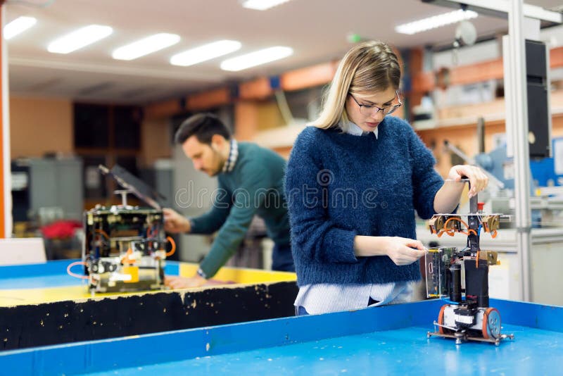 Young Woman Engineer Working on Robotics Project Stock Photo - Image of ...