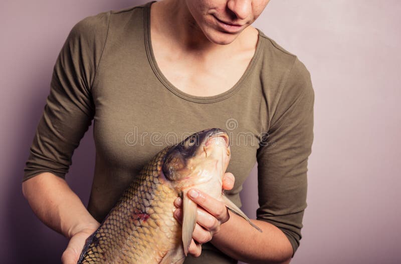 Young Woman Examinig Carp Stock Photos - Free & Royalty-Free Stock ...