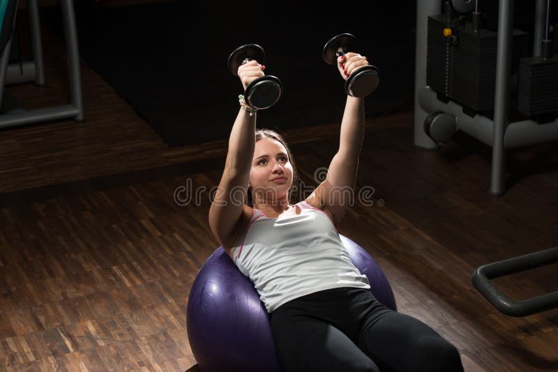 Young Woman Exercising Chest Stock Image - Image of exercising, athlete ...