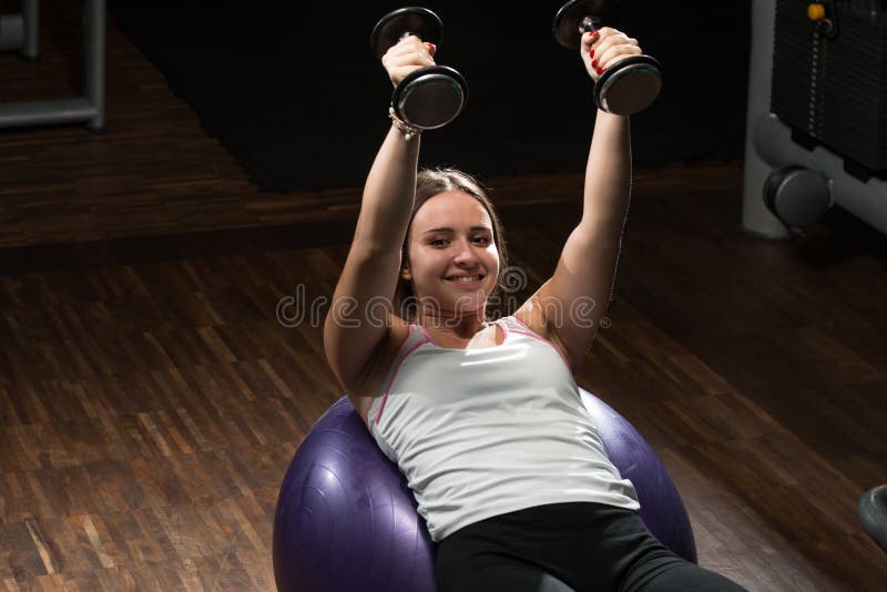Young Woman Exercising Chest Stock Image - Image of leisure, attractive ...
