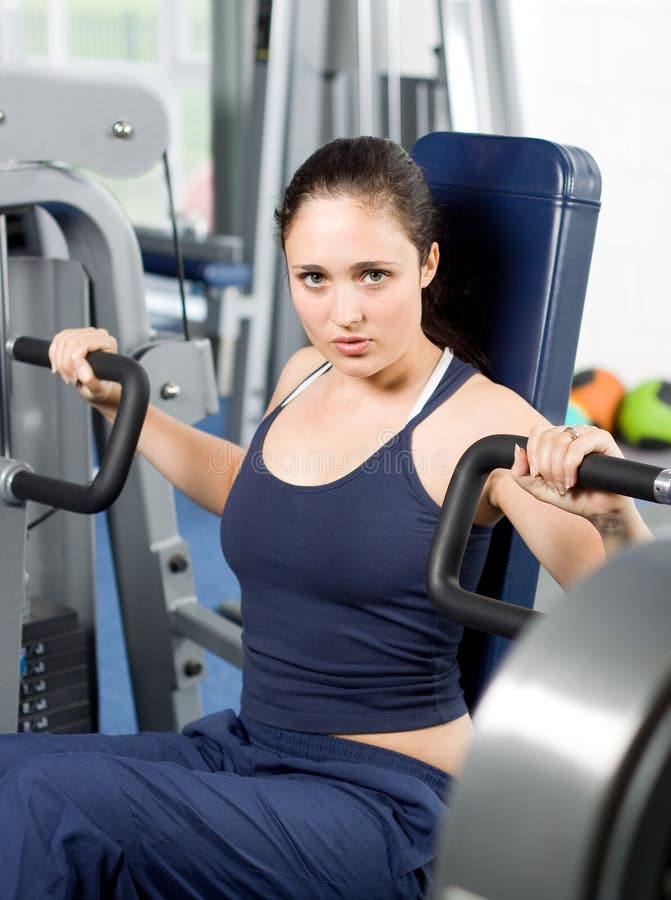 Young Woman Exercising in the Gym Stock Image - Image of exercising ...