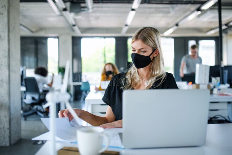 Young Woman with Face Mask Back at Work in Office after Lockdown ...