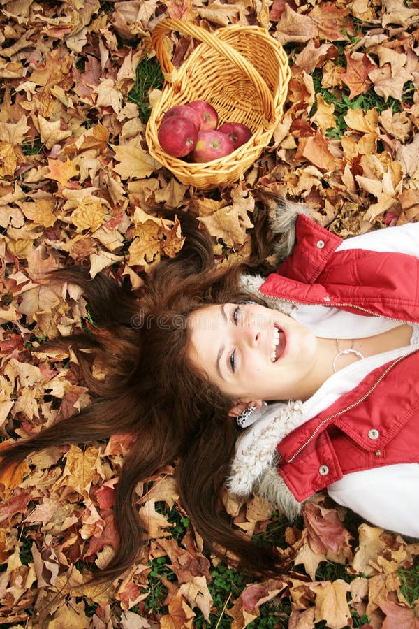 Young woman in fall leaves stock photo. Image of fall - 3325704