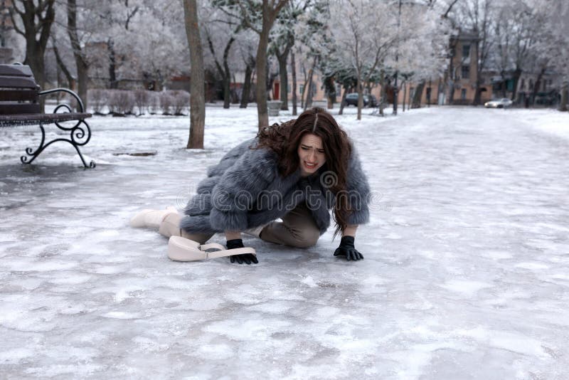 Young Woman Fallen on Slippery Icy Pavement in Park Stock Image - Image ...