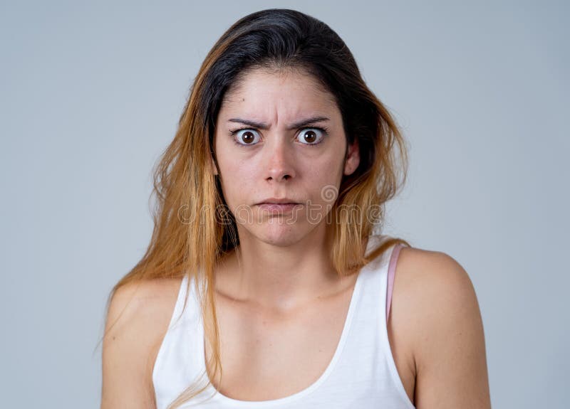 Portrait Of A Young Attractive Woman Looking Scared And Shocked Human