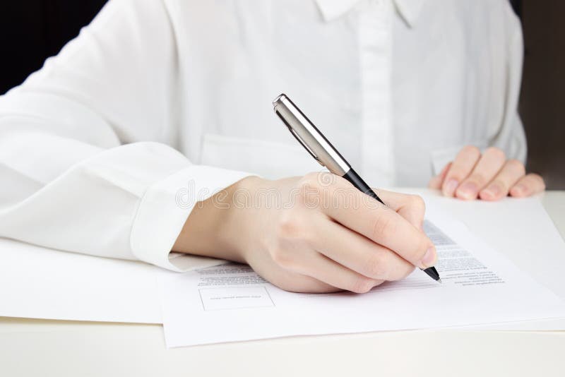 Young Woman Filling Out Paperwork Signing Documents Stock Photo - Image ... Young Woman Filling Out Paperwork Signing Documents Stock Photo - Image ...