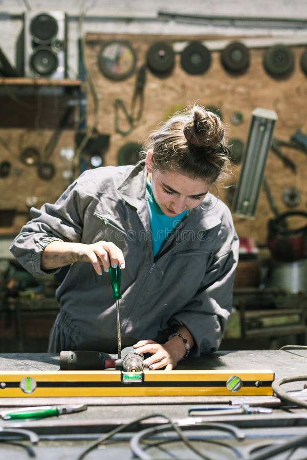 Young Woman Fixing Tool at Work Stock Image - Image of fixing, dirty ...
