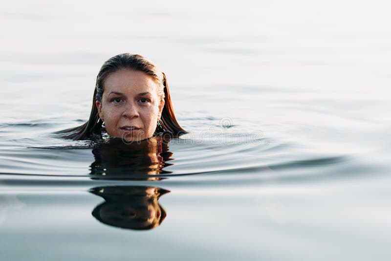 Young Woman Floating on the Water Surface in the Sea Stock Image ...