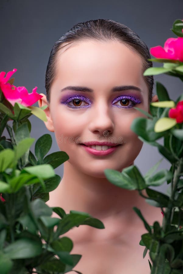 The Young Woman with Flowers in Beauty Concept Stock Image - Image of ...