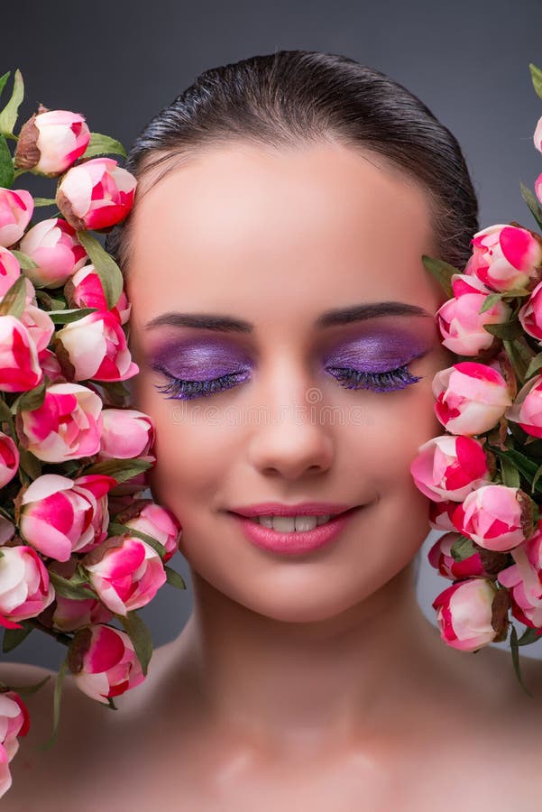 The Young Woman with Flowers in Beauty Concept Stock Photo - Image of ...