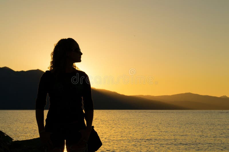 Young Woman in Front of Sunset Stock Photo - Image of mountains, people ...
