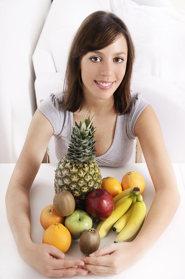 Young woman with fruit stock image. Image of blue, smiling - 16922701
