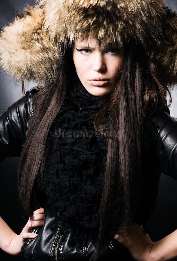 Young woman in a fur cap stock photo. Image of beauty - 16733962