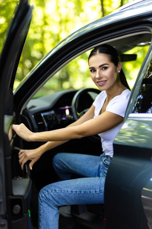 Young Woman Getting Out of Car. Outdoors Stock Image - Image of ...