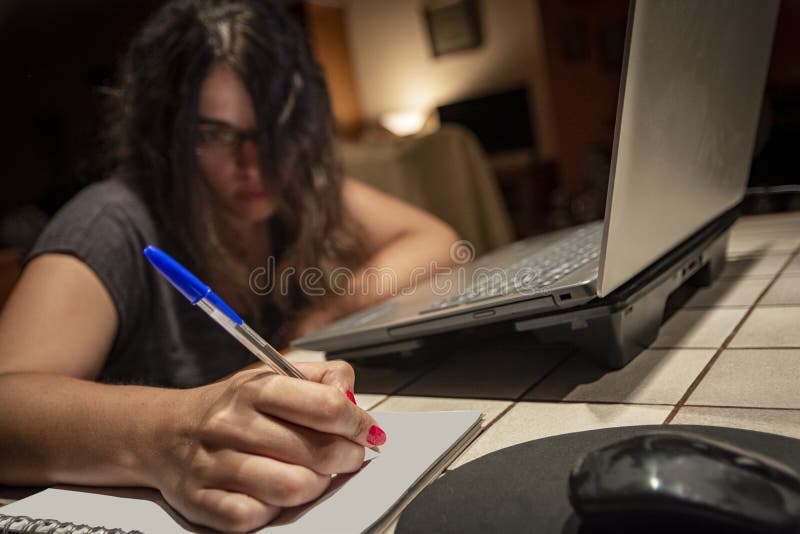Skeptical Young Woman with Glasses Working with Her Lap Top Stock Photo ...
