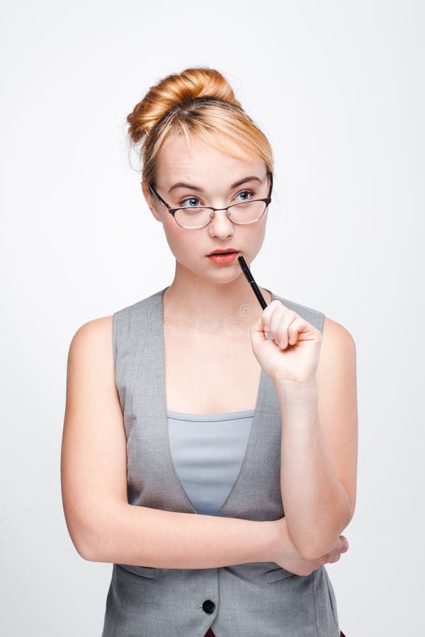 Young Woman in Glasses Thinks of Solving Problem Stock Photo - Image of ...