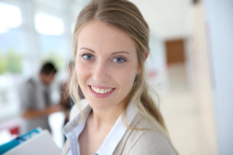 Young woman going to class stock photo. Image of smile - 64672808