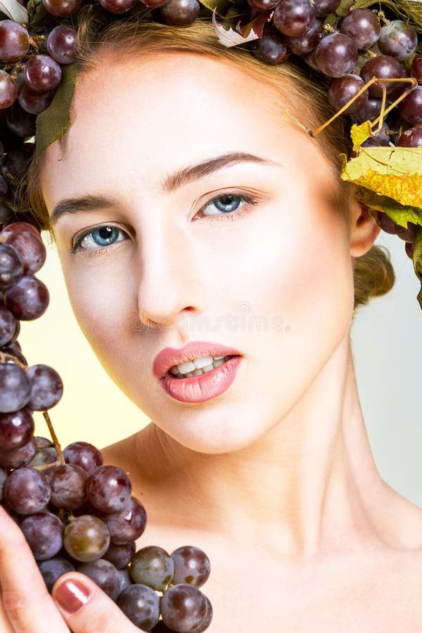 Young woman with grapes stock image. Image of berry, elastic - 62545709